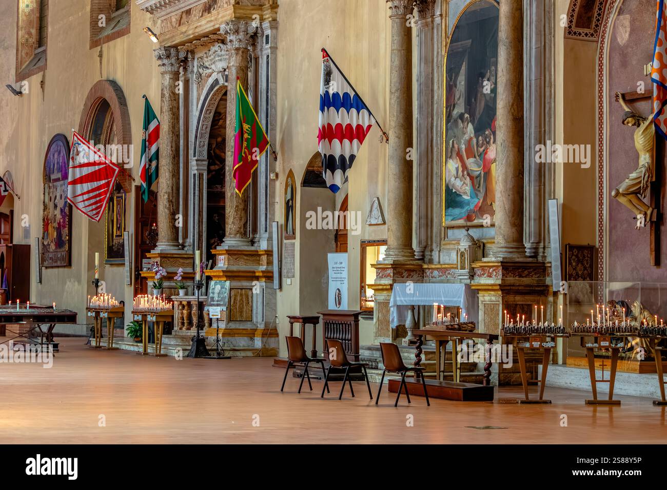The flags of various Siena Contrada hanging from the walls inside The ...