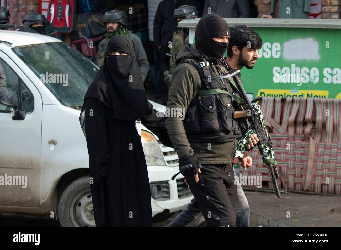 A Kashmiri burqa clad girl walks as Special Operations Group (SOG ...