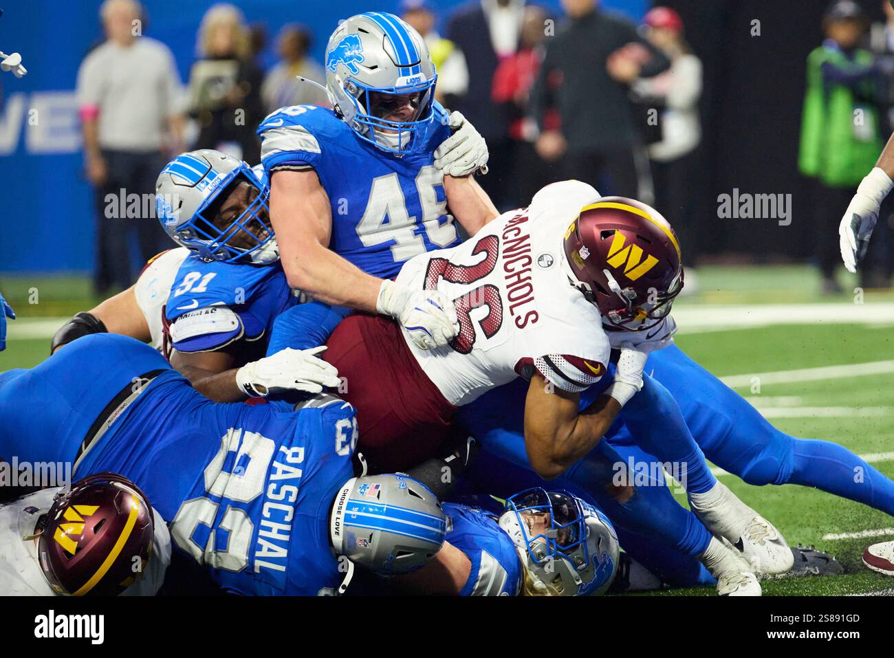 Washington Commanders running back Jeremy McNichols (26) is tackled by ...