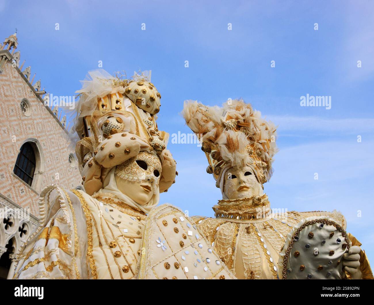 Two noble masks with Doge's Palace at background. St Mark's Square ...