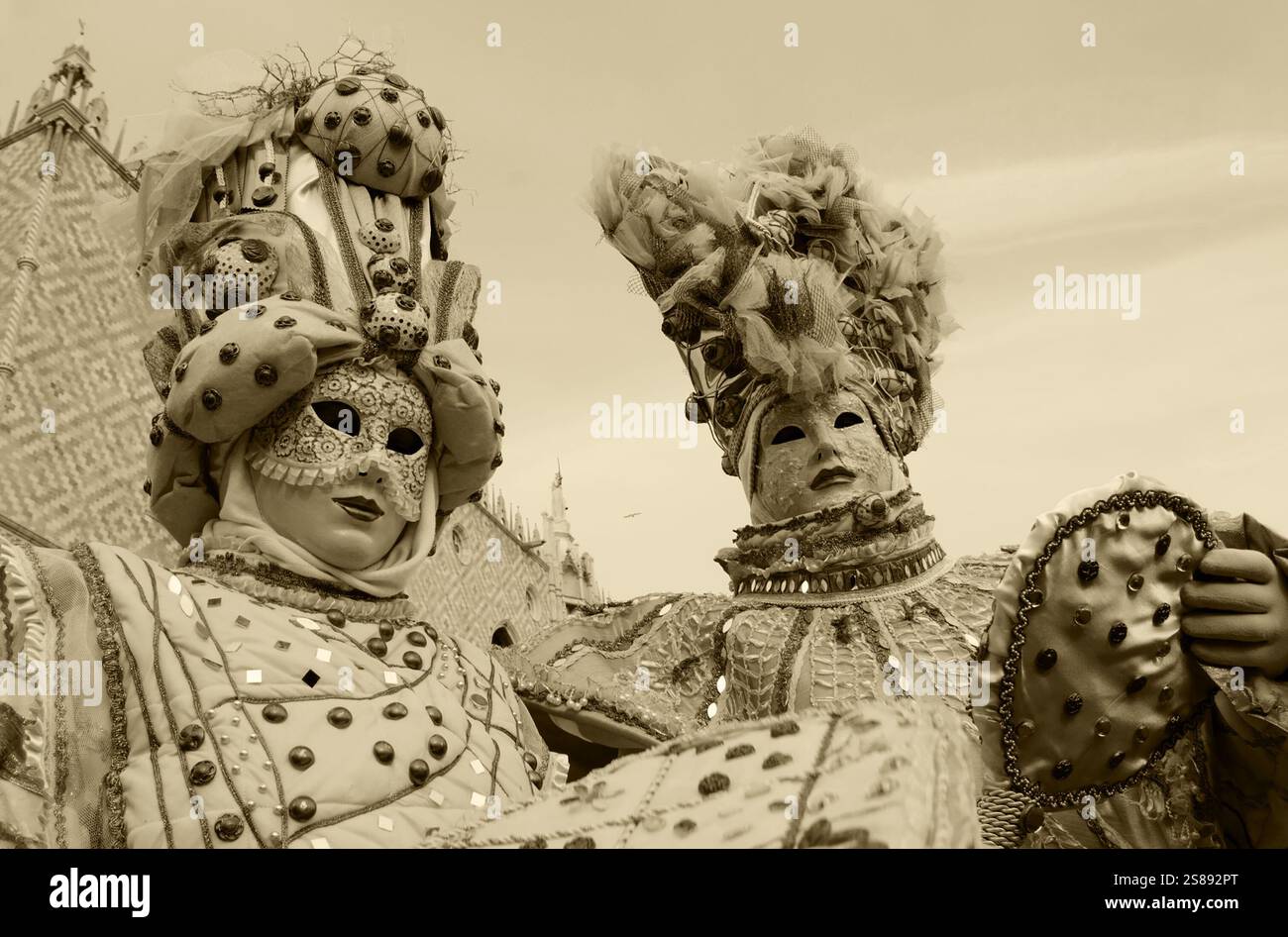 Two noble masks with Doge's Palace at background. St Mark's Square ...