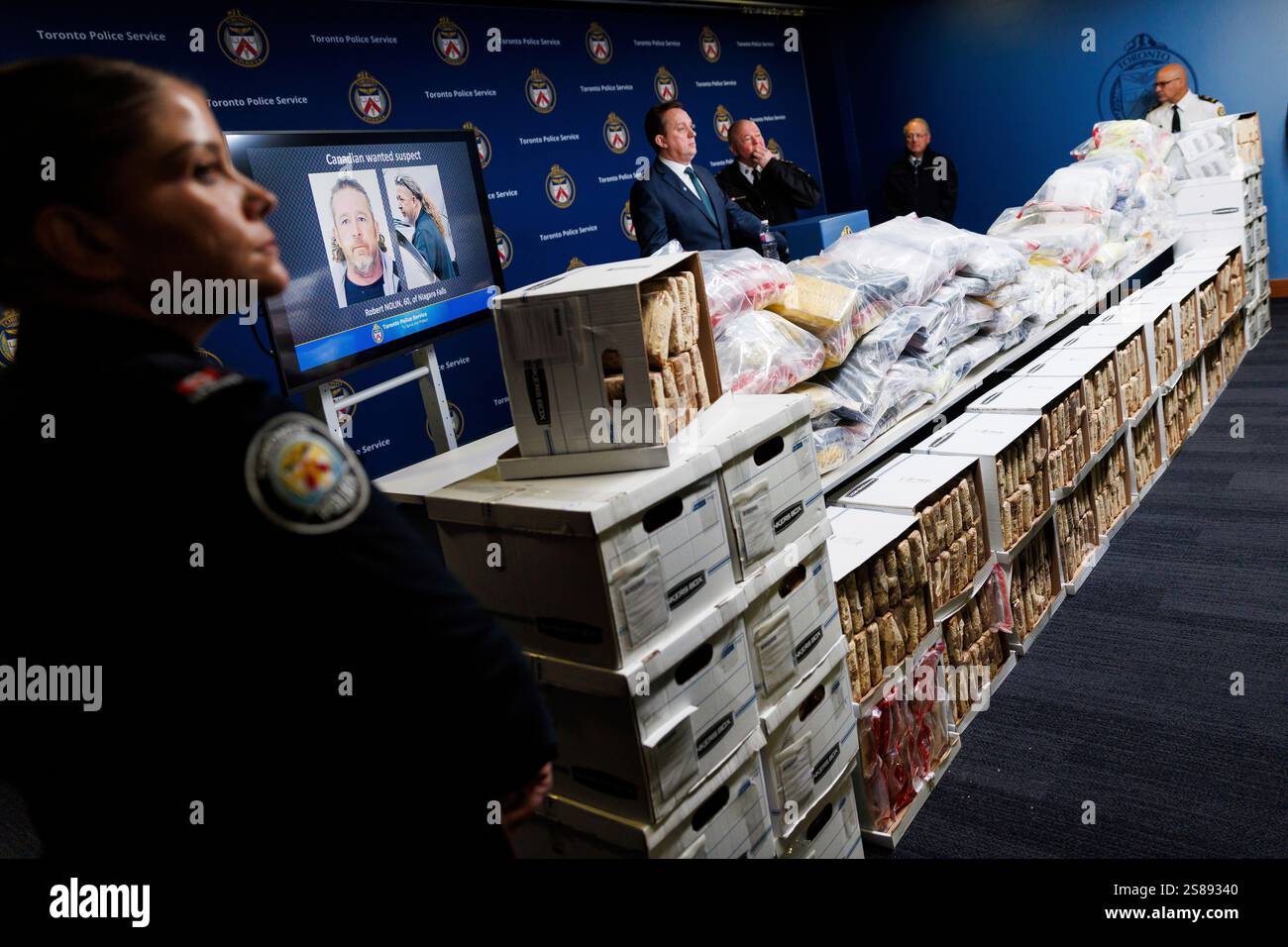 Toronto Police Supt. Paul MacIntyre, center left and Chief Myron Demkiw ...