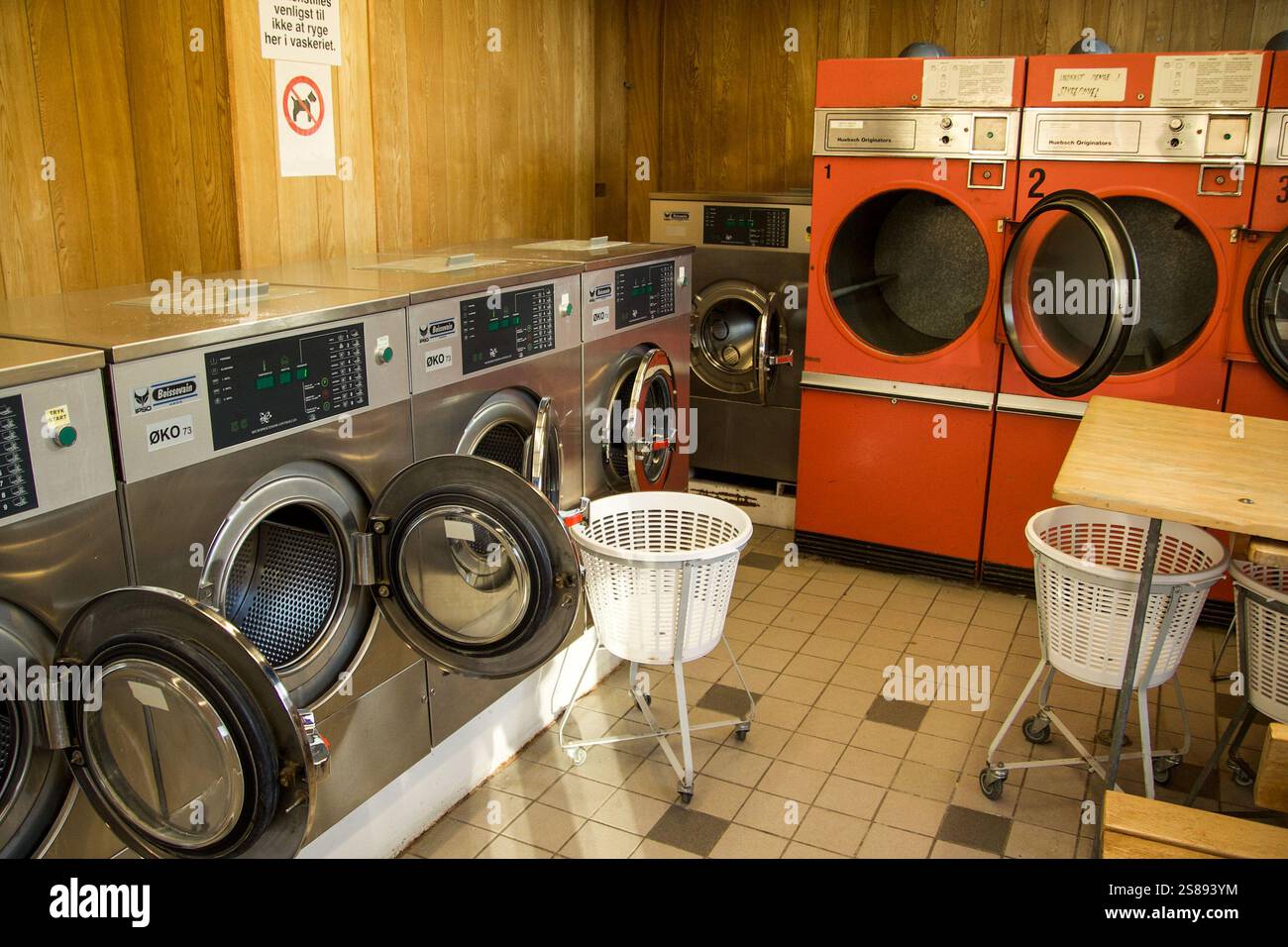 Washing machines and dryers seen inside self service laundry Stock ...