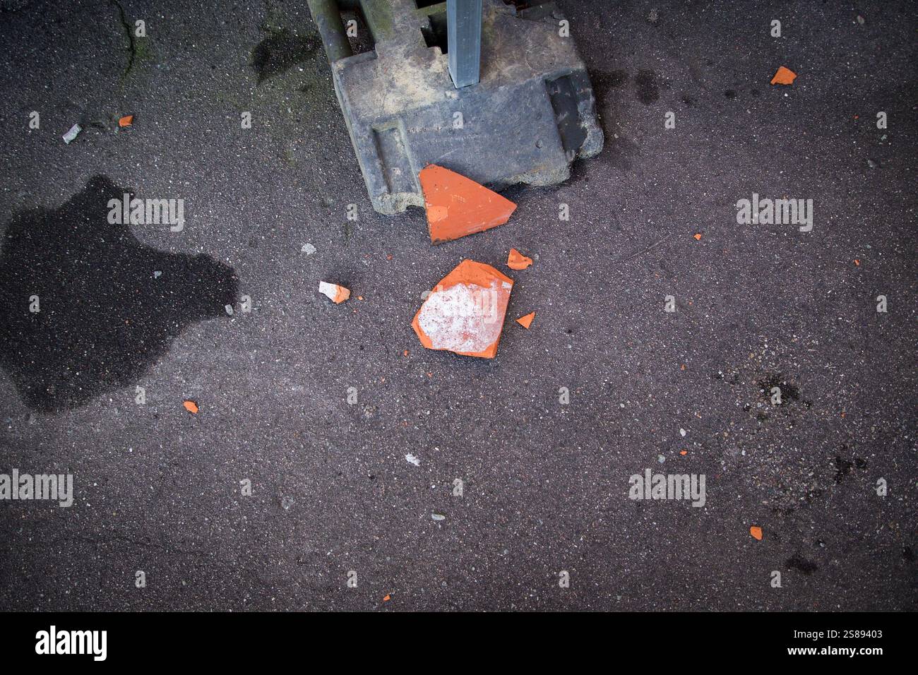 View of a broken roof shard on a sidewalk Stock Photo - Alamy