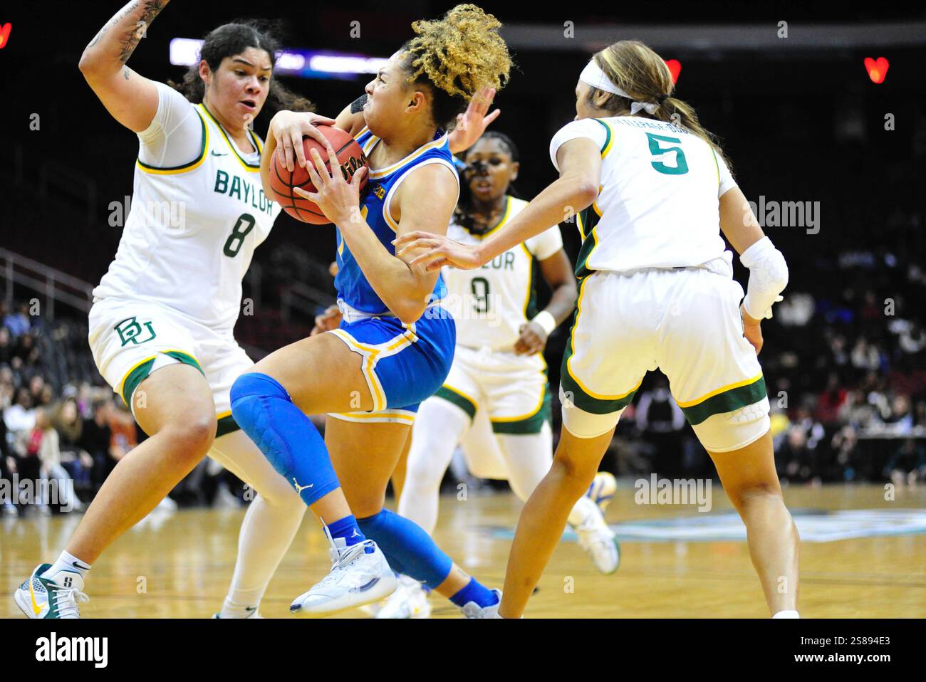 Newark, USA. 20th Jan, 2025. UCLA's Kiki Rice (1) drives the lane at ...