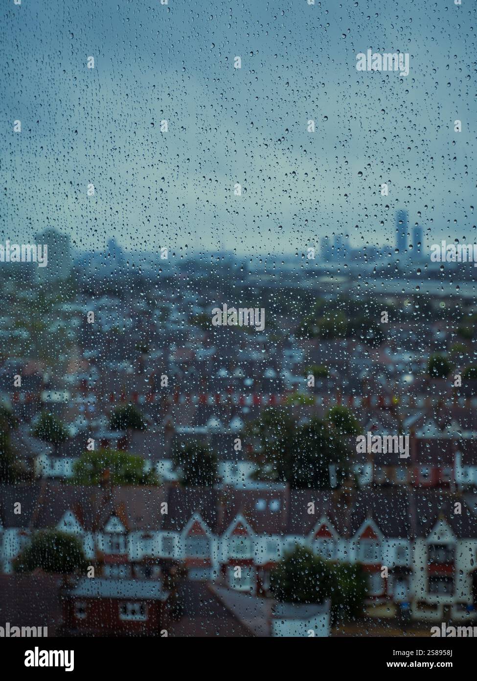 Rooftops from rainy window hi-res stock photography and images - Alamy