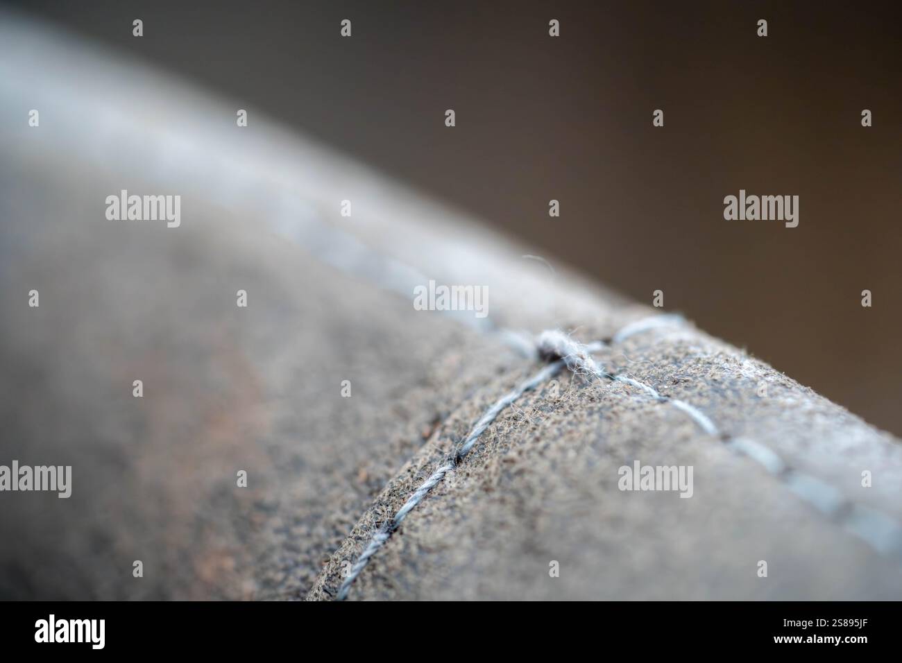 A close up of a tire with a white line running through it. The tire is ...