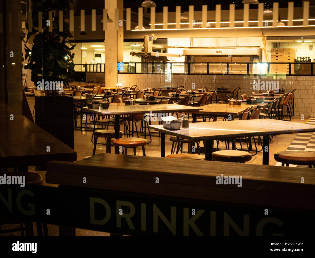 Empty cafe lit at night hi-res stock photography and images - Alamy