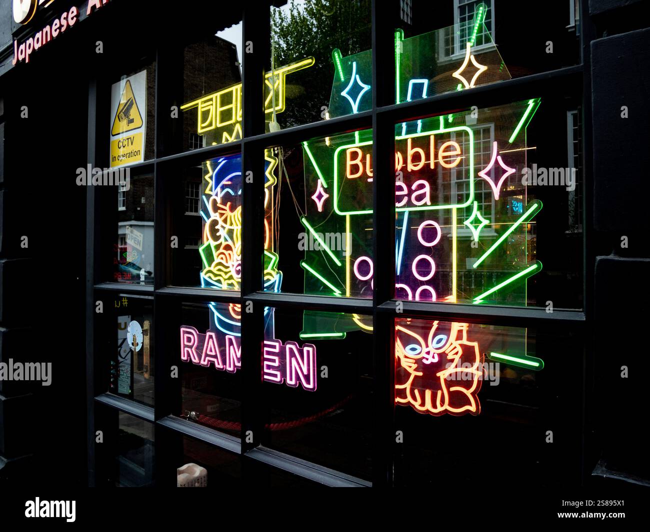 Neon signs advertise ramen and bubble tea Stock Photo - Alamy