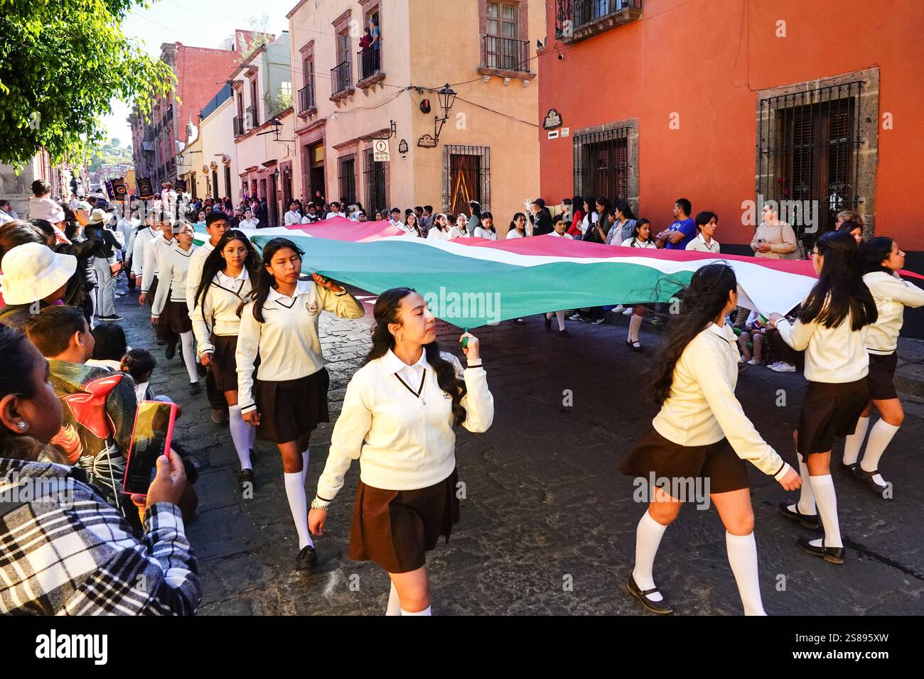 San Miguel de Allende, Mexico. 21st Jan, 2025. School girls carry a ...