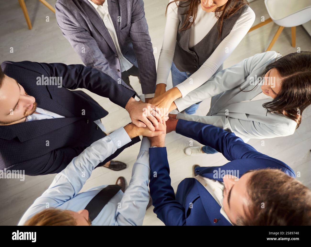 Top view photo of business people group putting their arms together in pile in a circle Stock ...