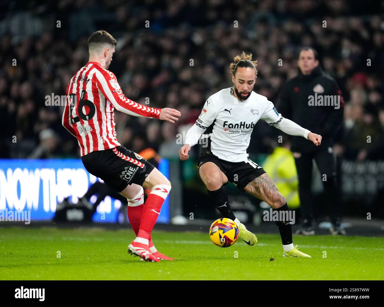 Sunderland's Chris Mepham (left) and Derby County's Marcus Harness ...