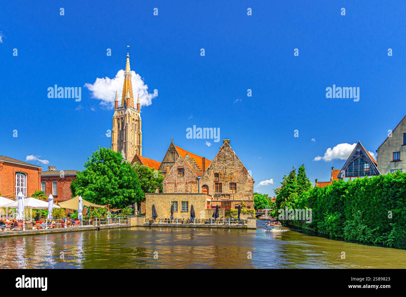 Bakkersrei water canal with tourist boat, Catholic Church of Our Lady ...