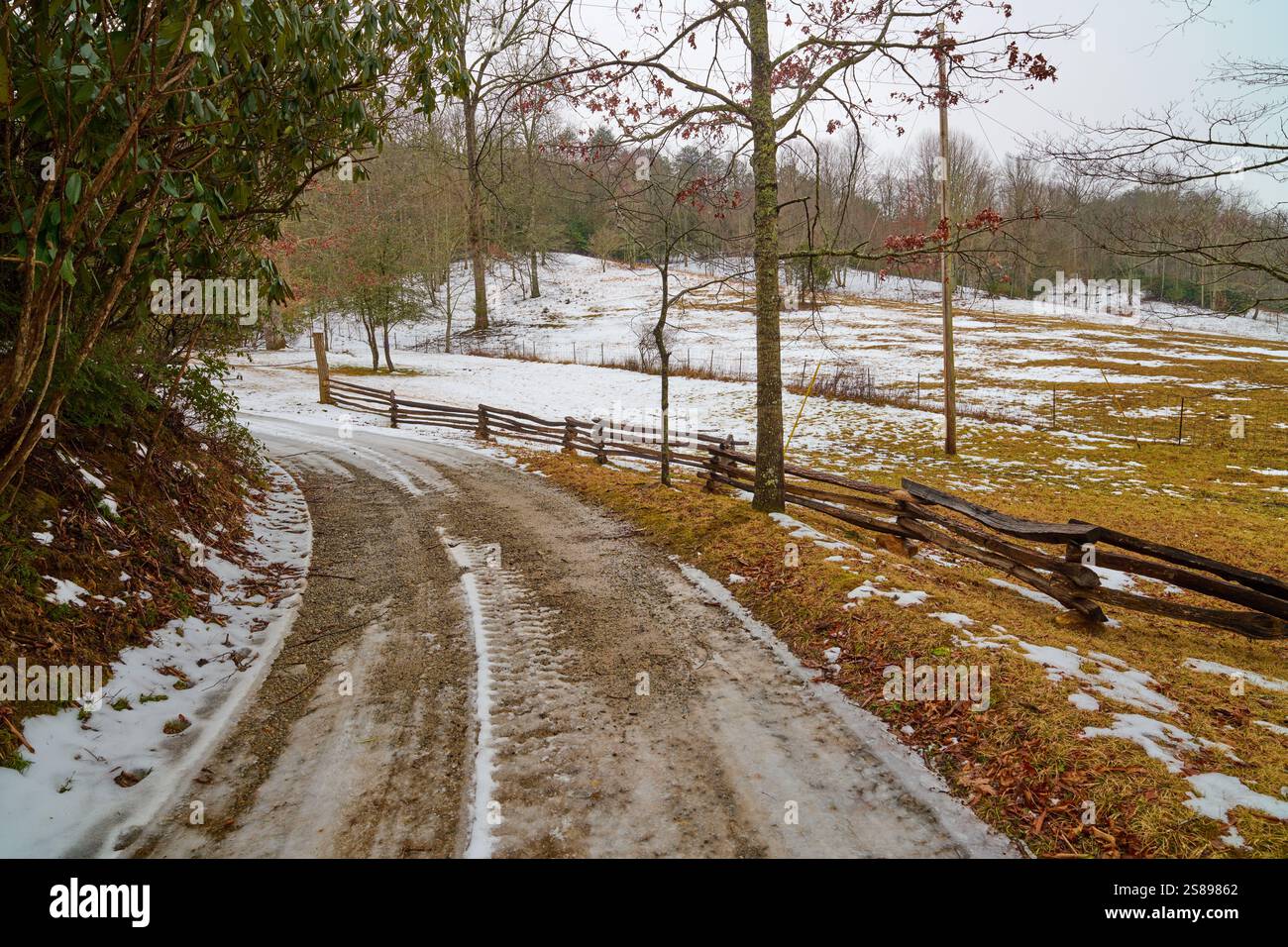Picket fence along ice covered road near Pisgah National Forest, North ...