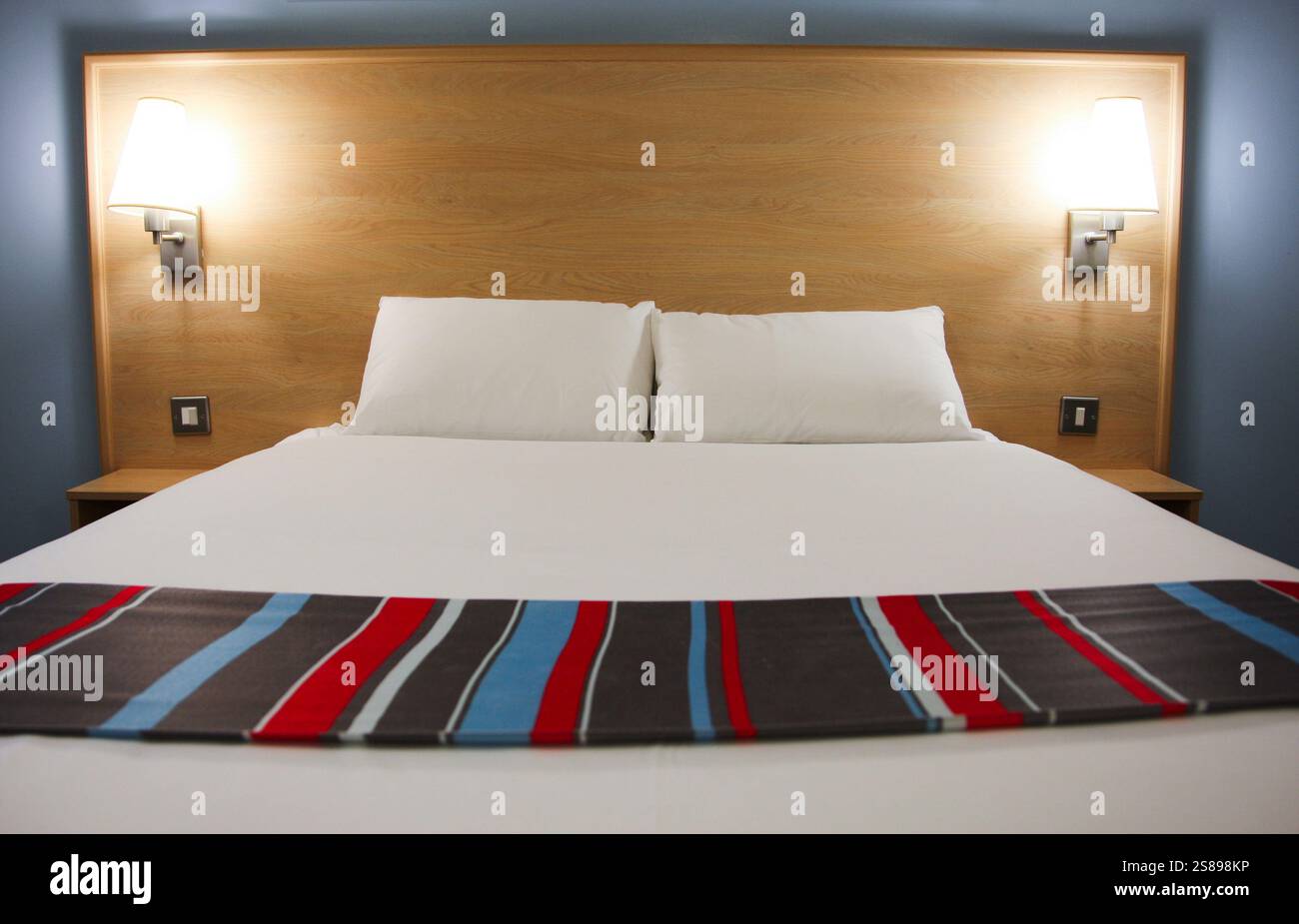 Standard budget hotel double bed Stock Photo - Alamy
