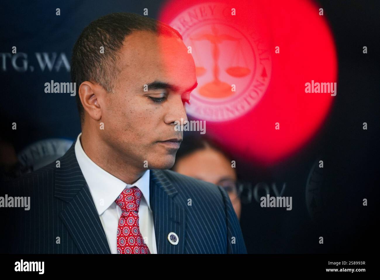 Washington Attorney General Nick Brown looks on during a press ...