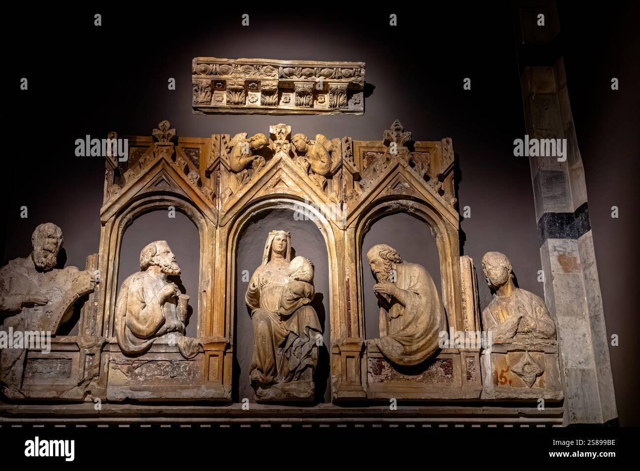 Madonna and child a stone carving inside The Museo Dell'Opera Metropolitandel Duomo in Siena ...