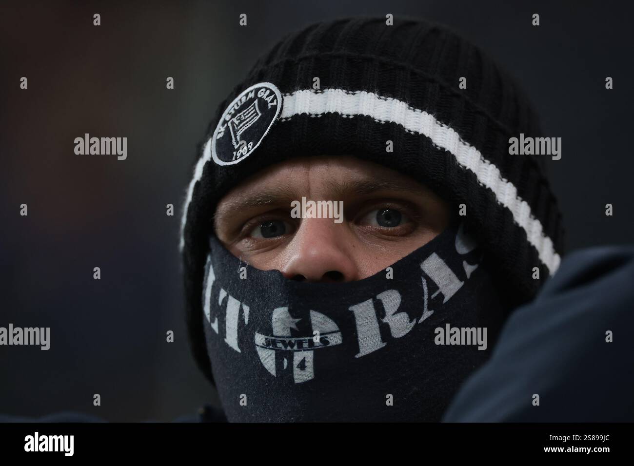 Bergamo, Italy. 21st Jan, 2025. A Sturm Graz fan wearing an Ultras face ...