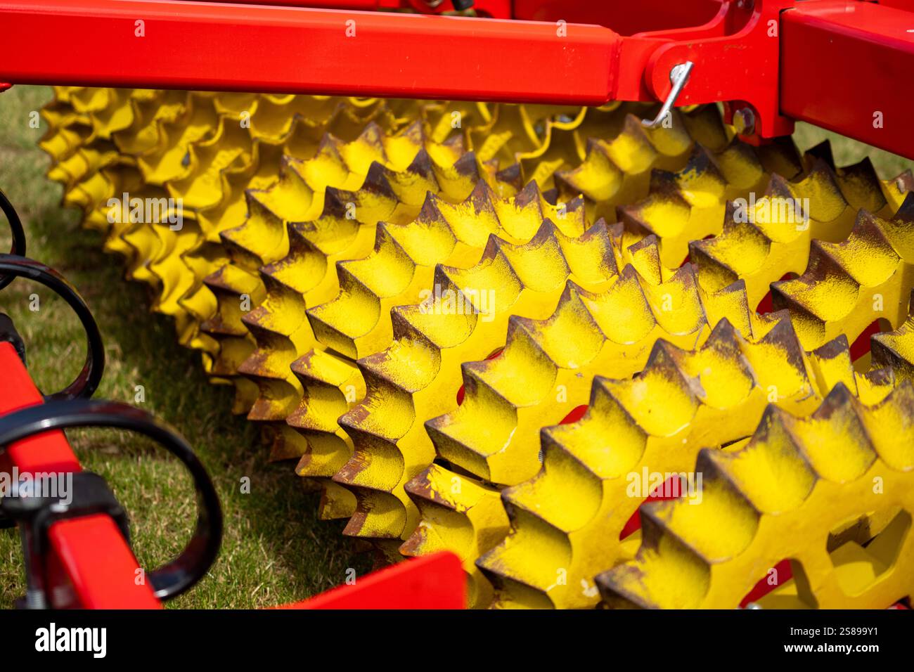 A yellow and black machine with yellow spikes. The yellow spikes are ...