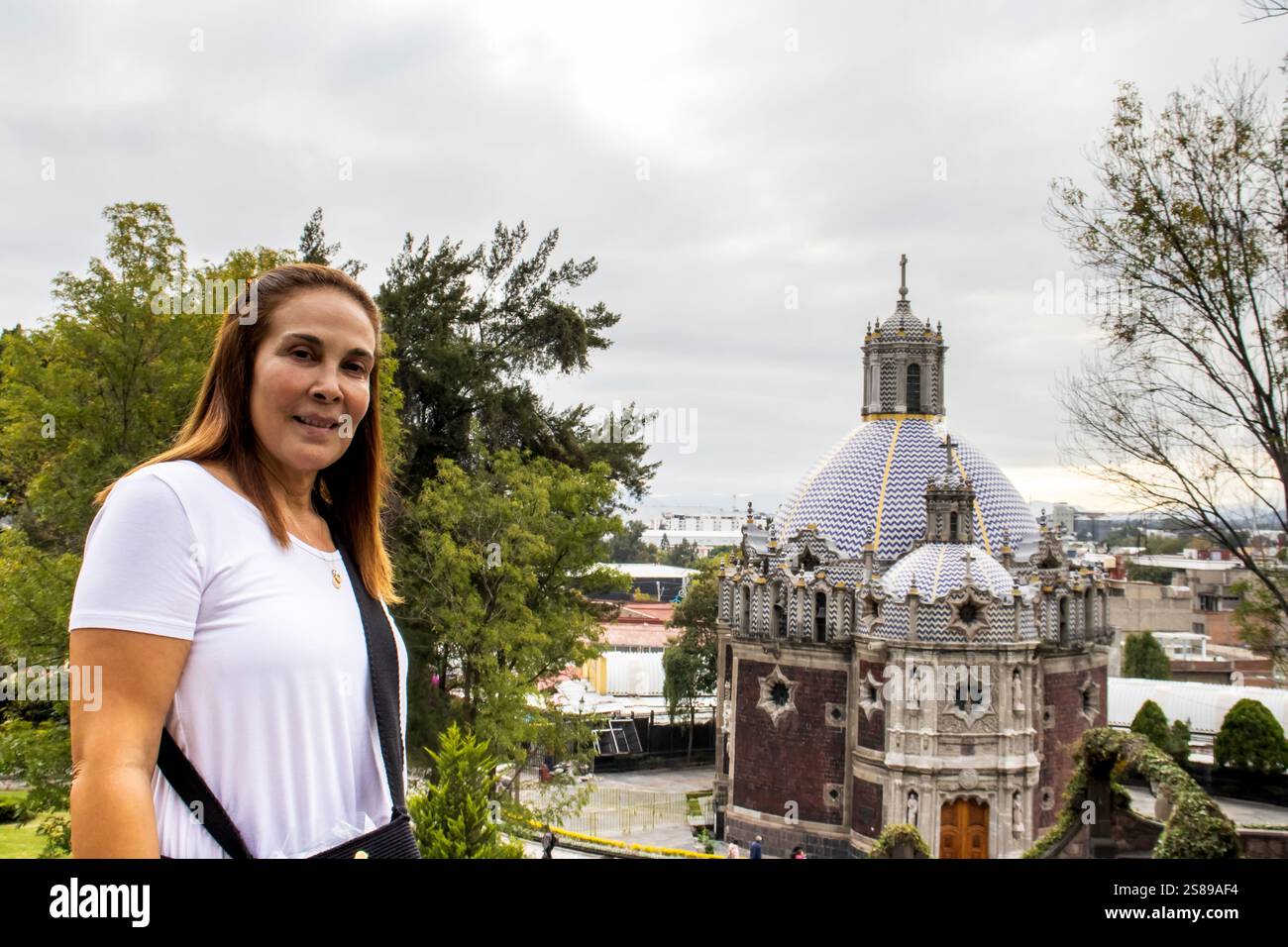 Female tourist visiting the Basilica of Guadalupe complex and the ...