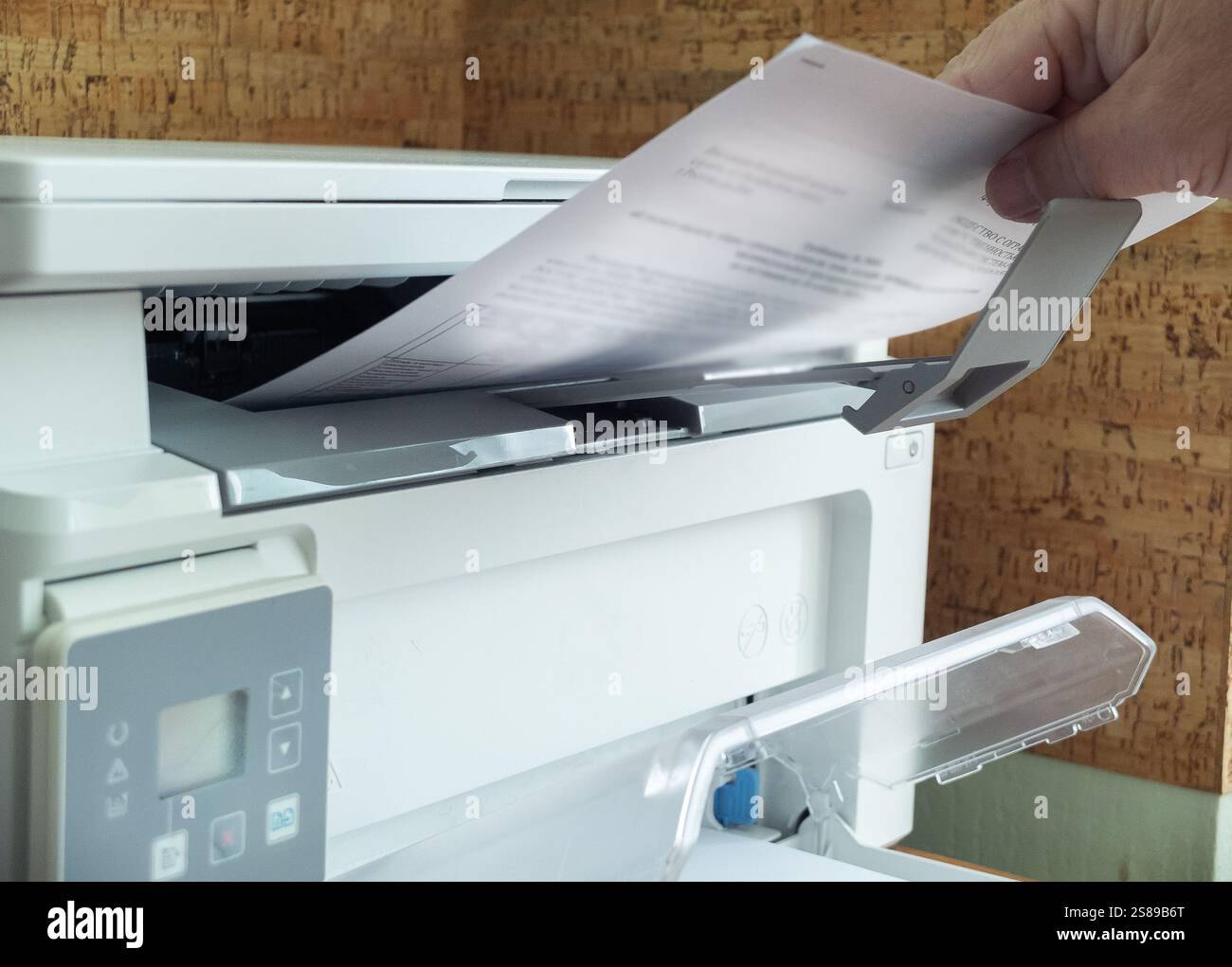Copier printer, A man makes a copy of a sheet document in the printer ...
