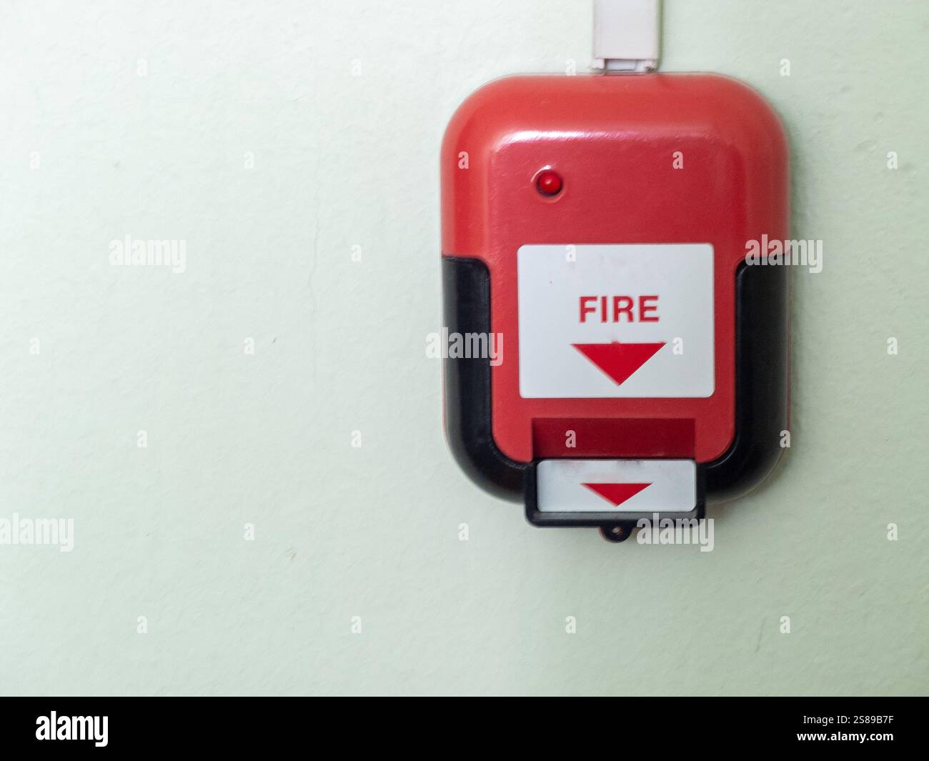 Red fire alarm call sensor alarms on the walls of shopping centers ...