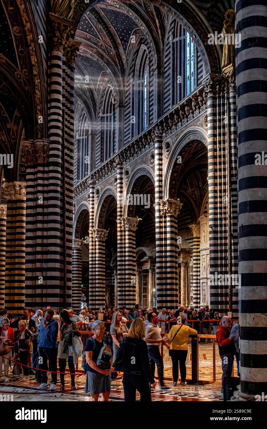 People admiring the stunning interior of Siena Cathedral a 13th-century ...
