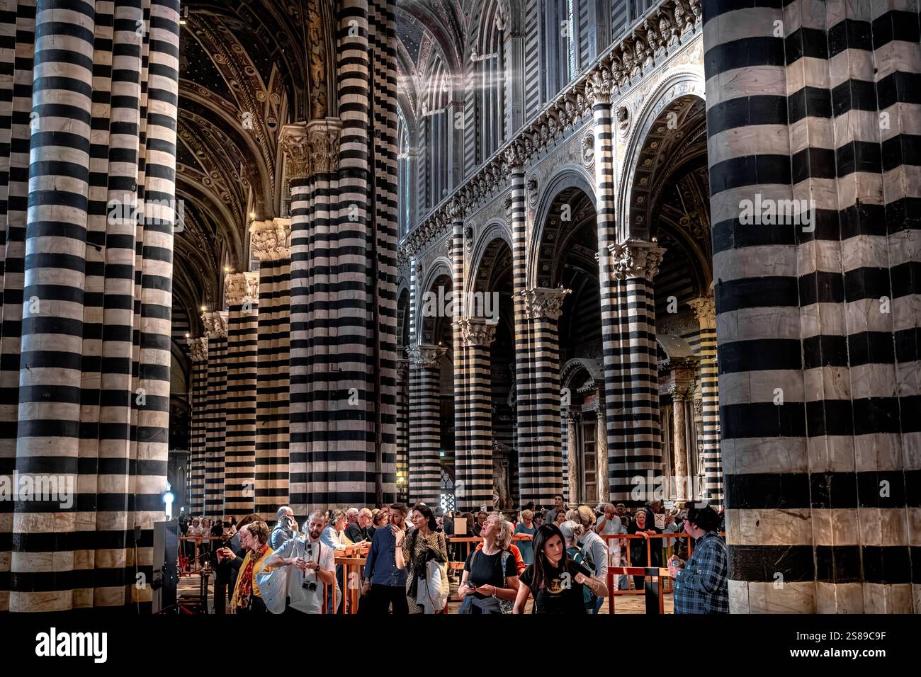 People admiring the stunning interior of Siena Cathedral a 13th-century ...