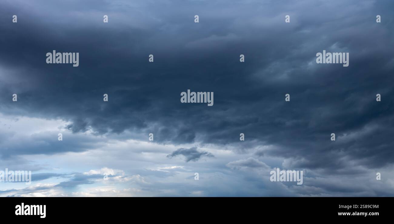Dramatic sky with dark storm clouds gathering, promising heavy rain and ...