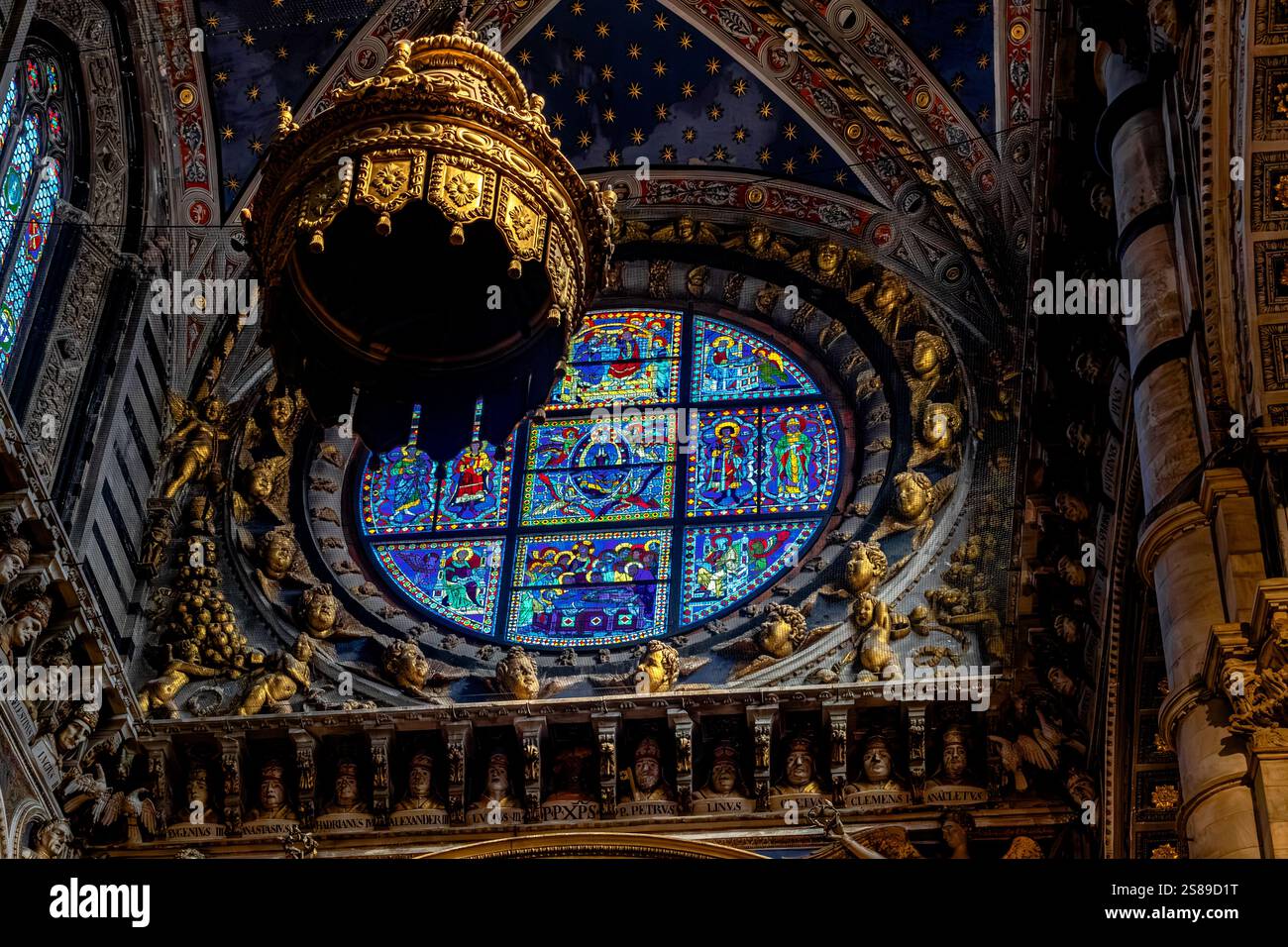 The Virgin Mary Saints stained glass Rose Window inside Siena Cathedral ...