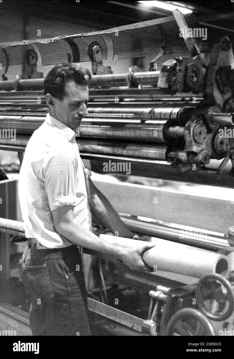 A customer roll paper making Stock Photo - Alamy