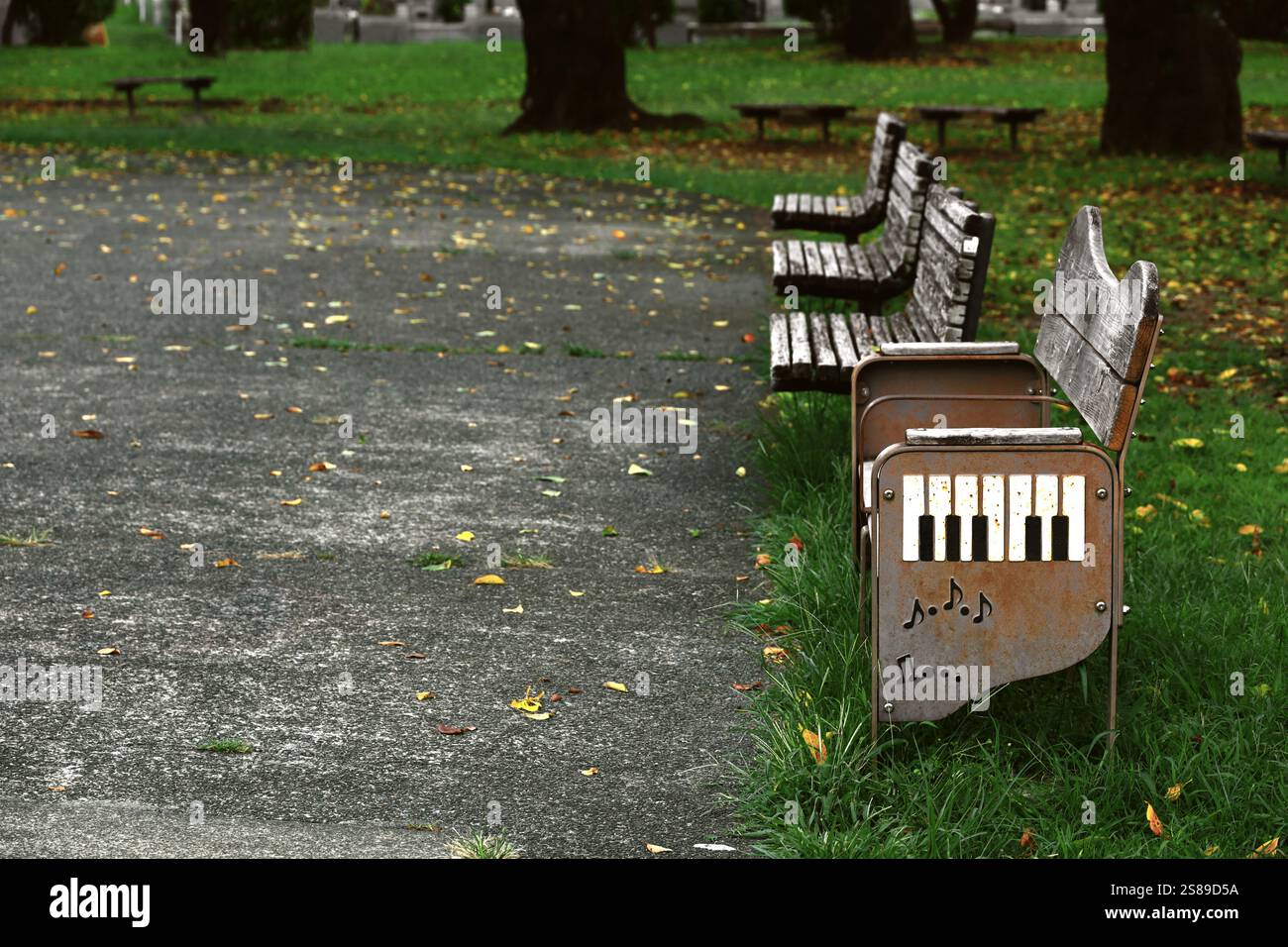Park bench with illustration of piano keys and musical notes symbols ...