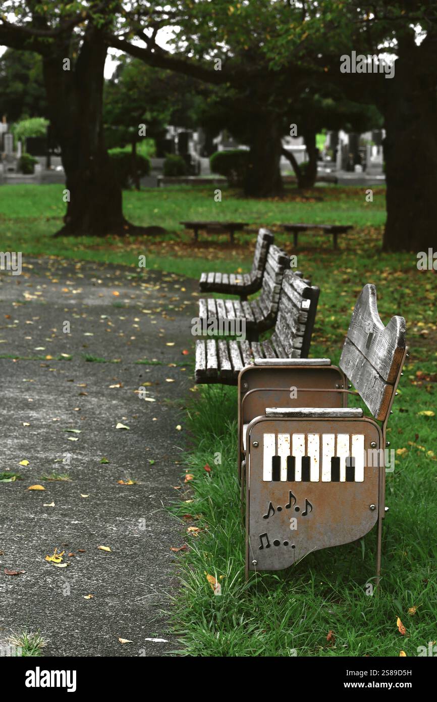 Park bench with illustration of piano keys and musical notes symbols ...