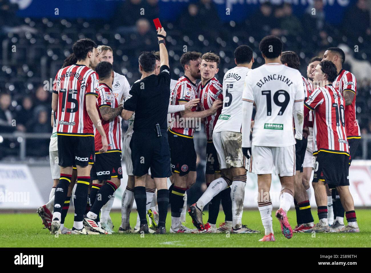 Swansea, UK. 21st Jan, 2025. Match Referee Dean Whitestone shows a red ...