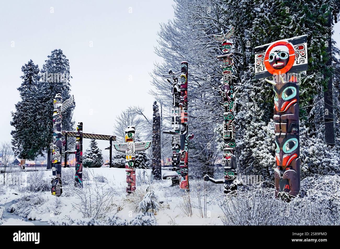 West coast First Nations totems with rare covering of Winter snow ...