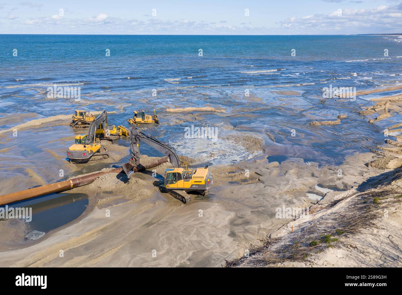 Beach restoration sand bulldozers hi-res stock photography and images ...