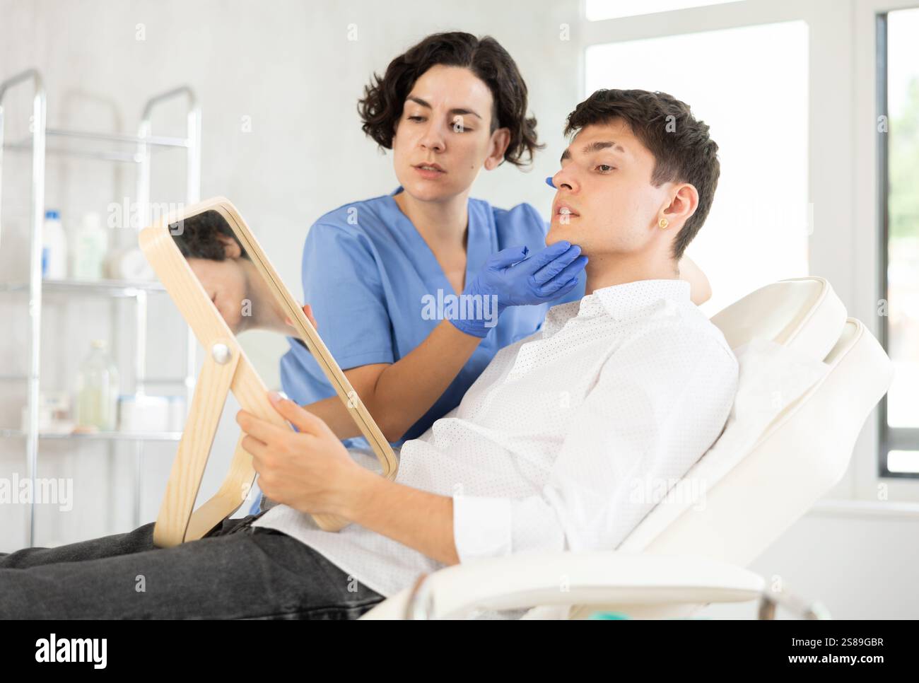 male patient with mirror Stock Photo - Alamy