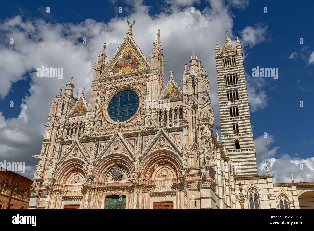 The exterior front facade of the spectacular Siena Cathedral , a13th ...