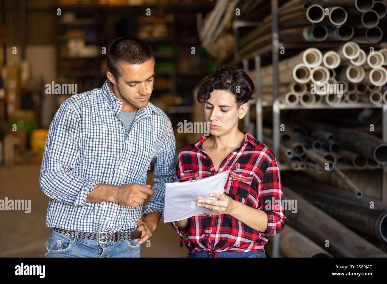 Manager and employee together conduct accounting and inventory in the ...