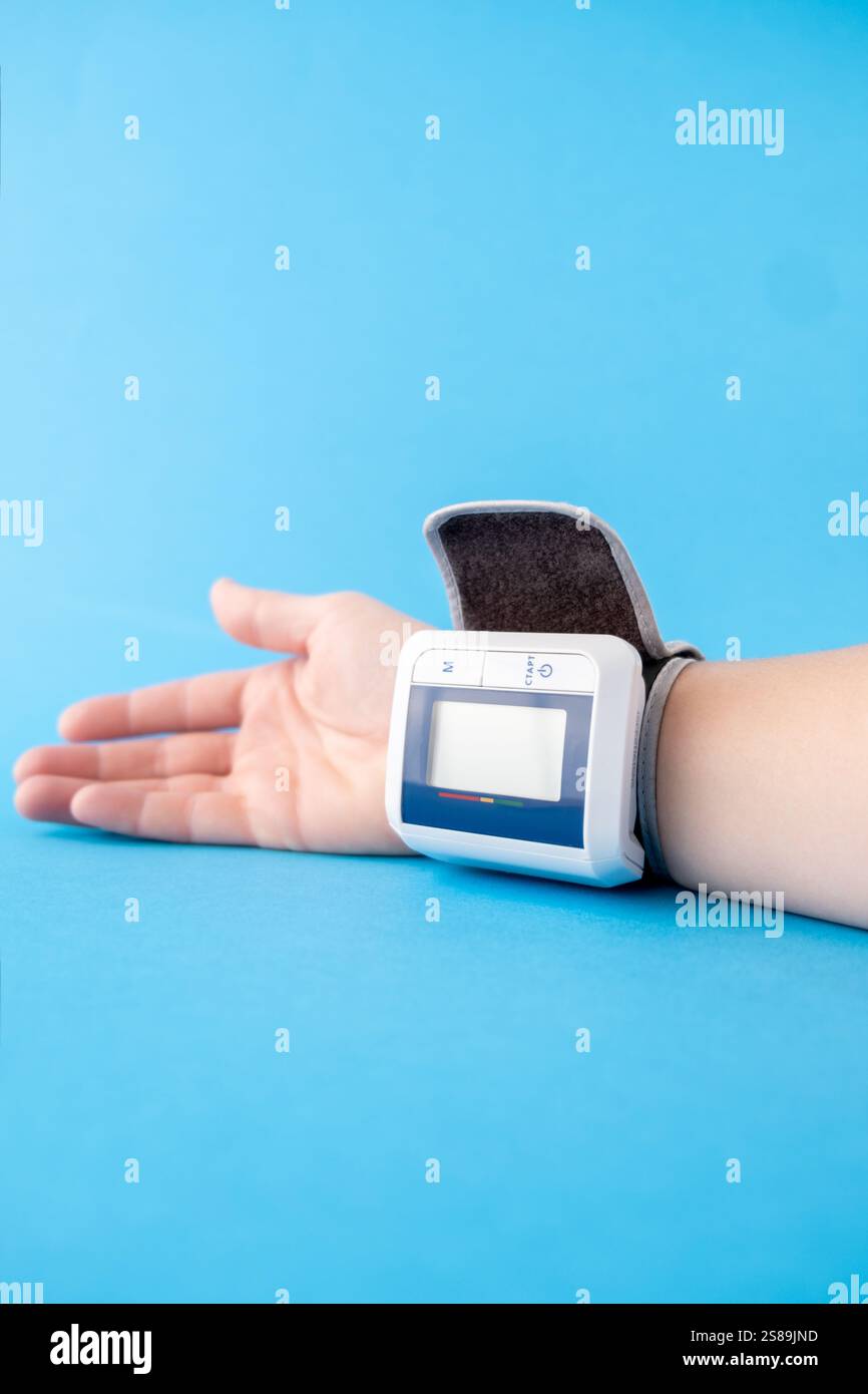 Blood pressure measurement process, light skinned woman's arm, blood ...