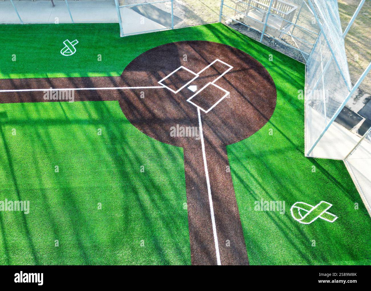 Brightly colored artificial baseball field features fresh turf and ...