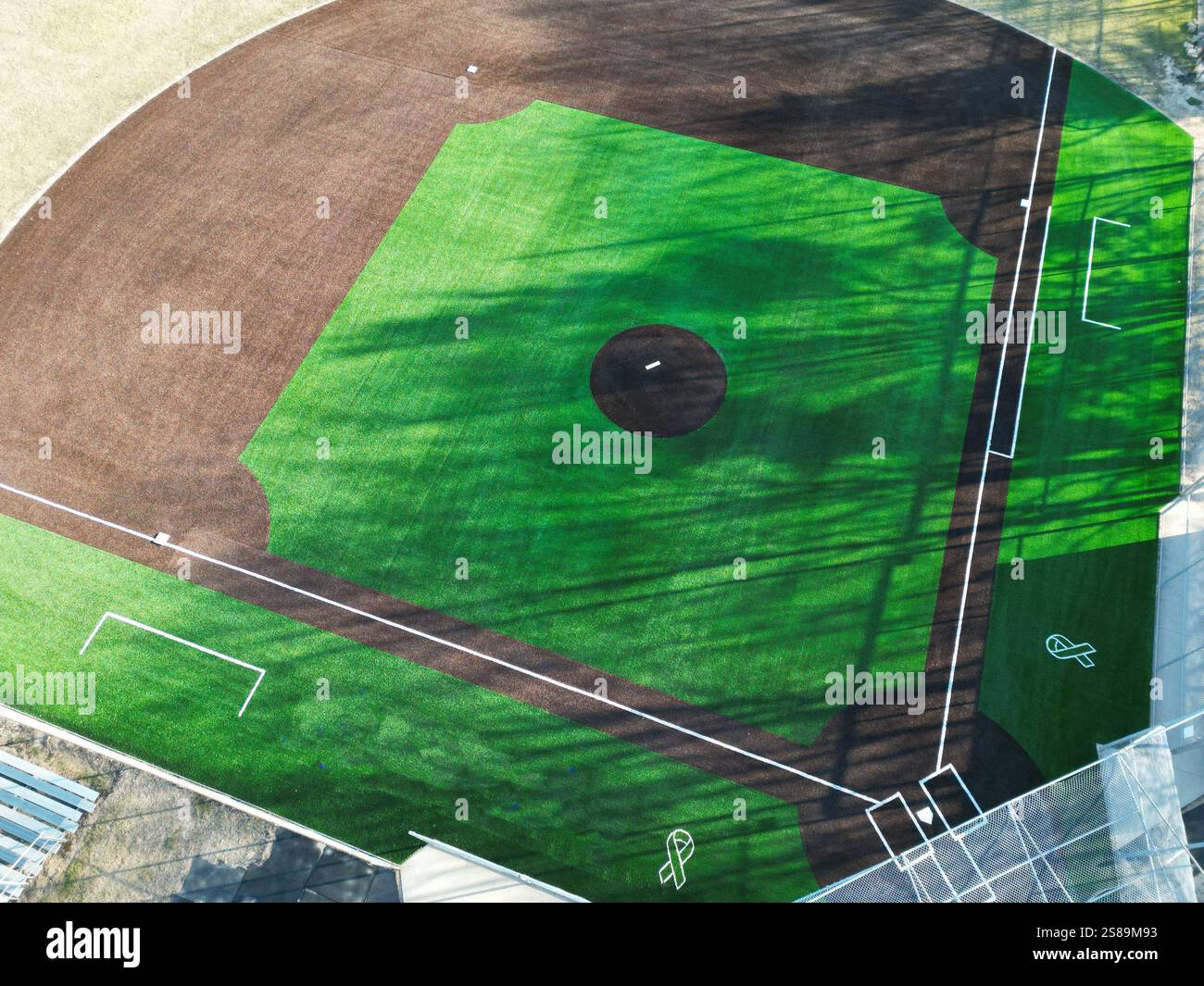 Aerial view of a new artificial turf baseball field with bright green ...