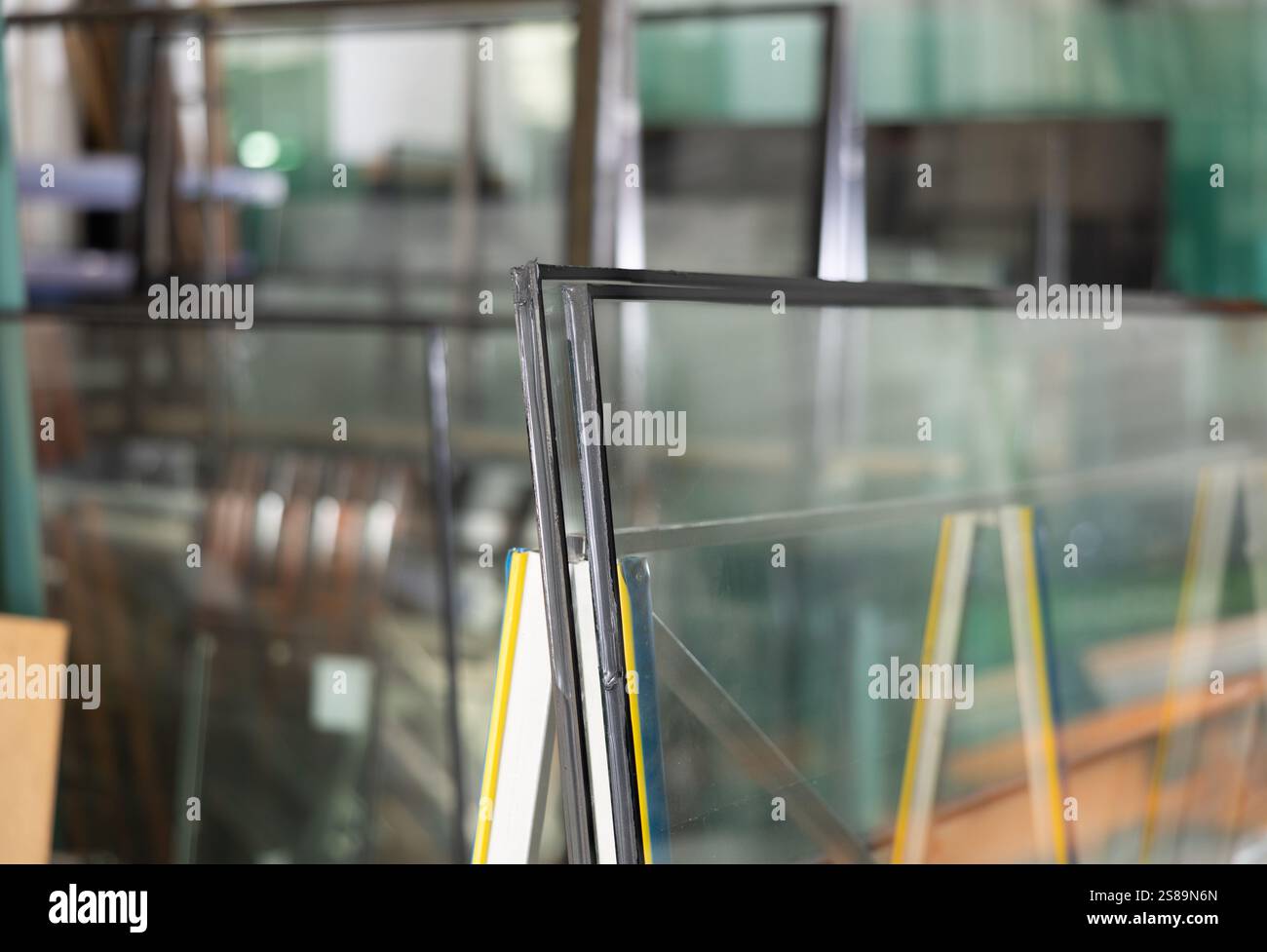 Insulated glass units stacked on support stand in workshop Stock Photo ...