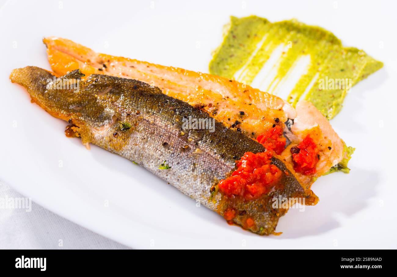 Roasted trout fillet with sauces Stock Photo - Alamy