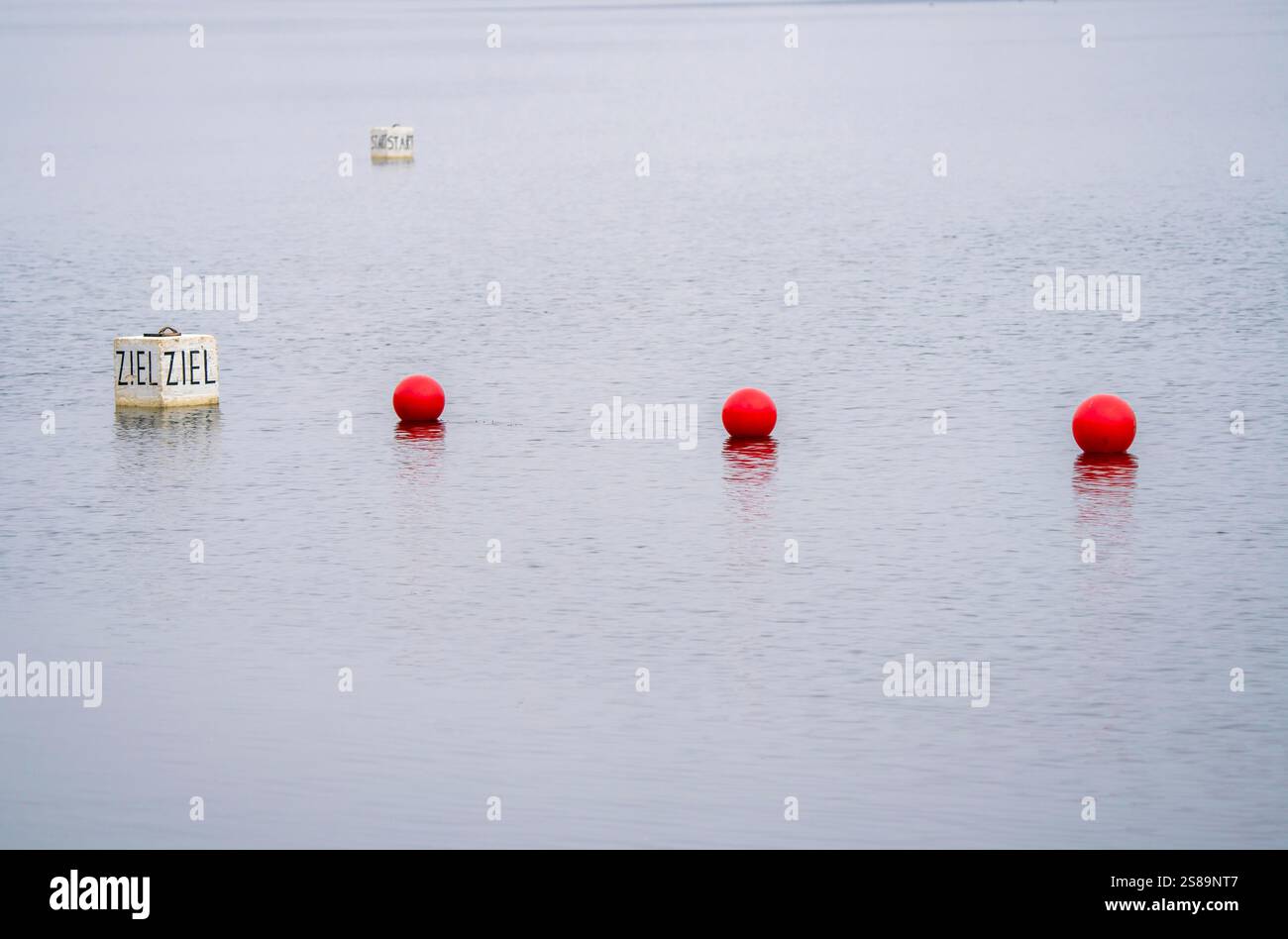 Target buoy on a lake, red marking buoys for water sports, regattas ...