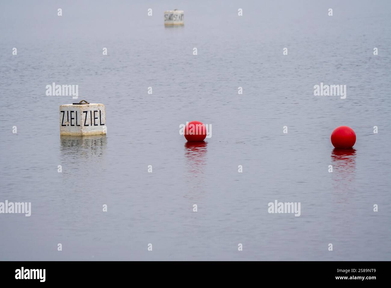 Target buoy on a lake, red marking buoys for water sports, regattas ...