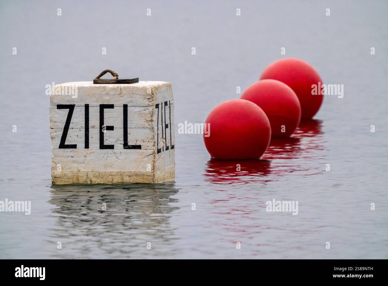 Target buoy on a lake, red marking buoys for water sports, regattas ...