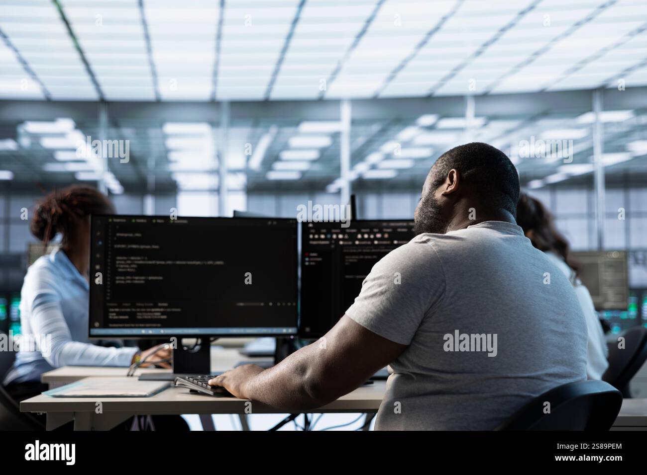 Data center employee using PC to find misconfigurations affecting ...