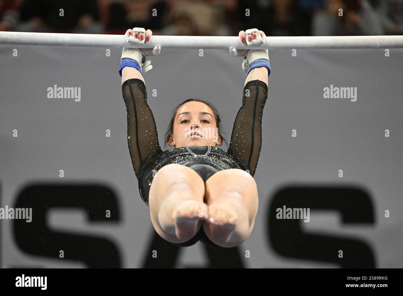 Denver gymnast Madison Ulrich competes on the uneven bars during an ...