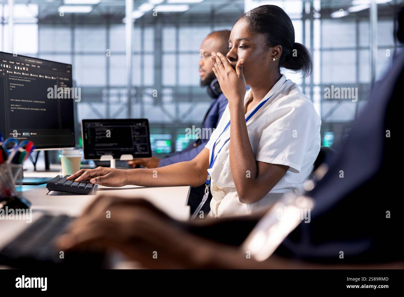 Tired data center engineer yawning hi-res stock photography and images - Alamy